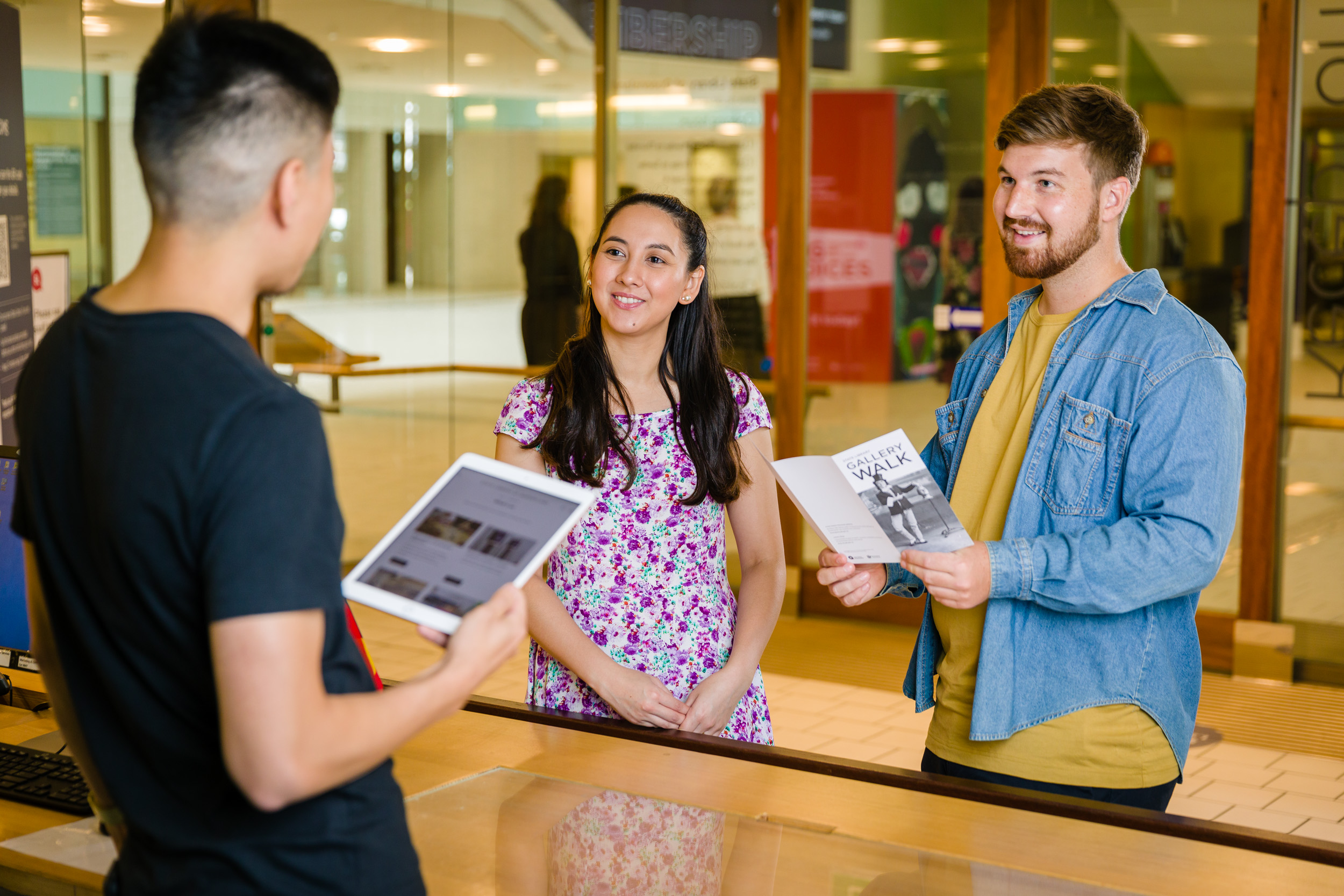 Client speaking to staff member | State Library of Queensland