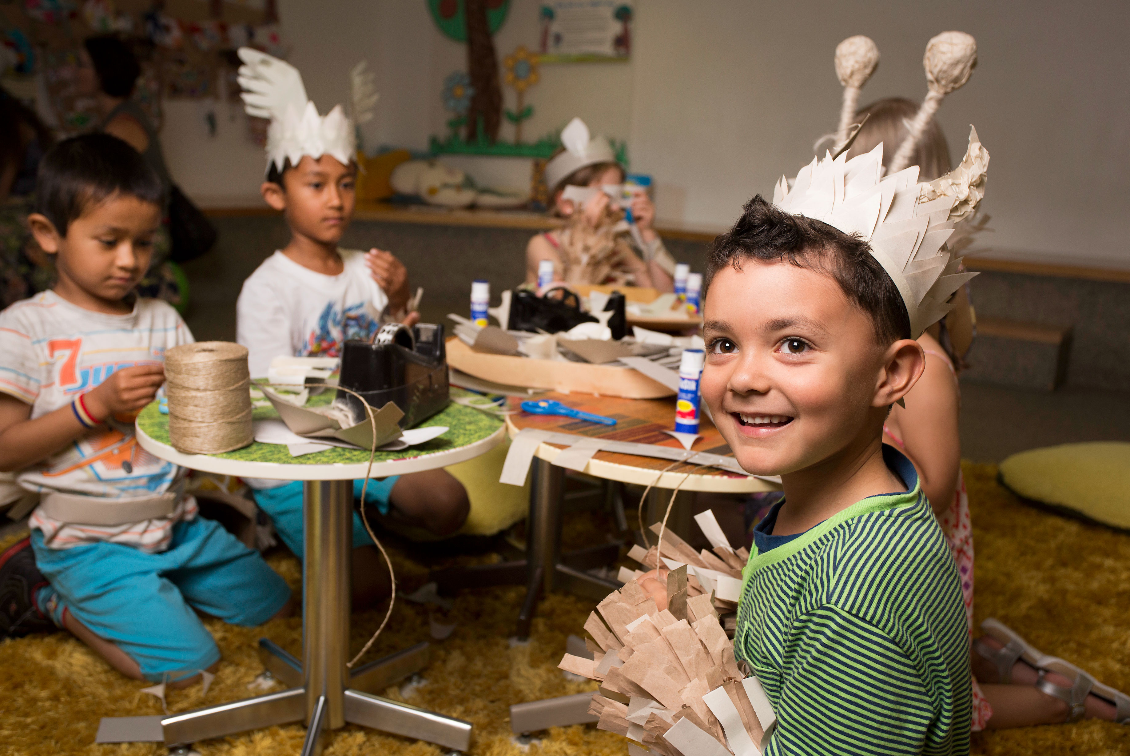 Children making paper costumes | State Library of Queensland