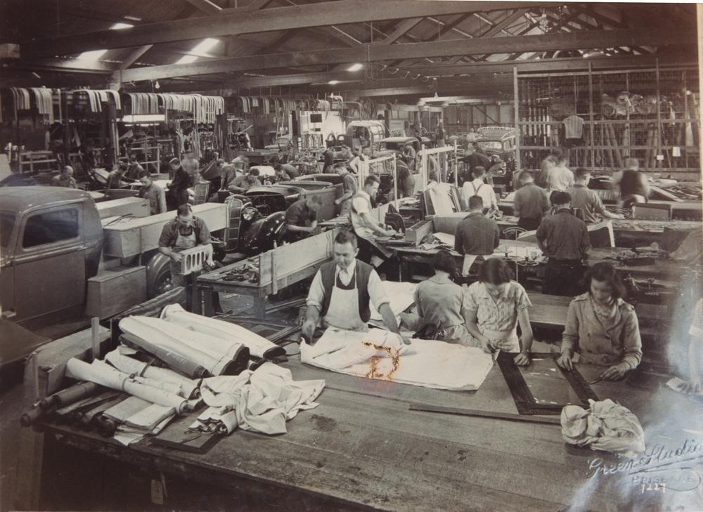 Studying blueprints in Hope Body Works factory | State Library of ...